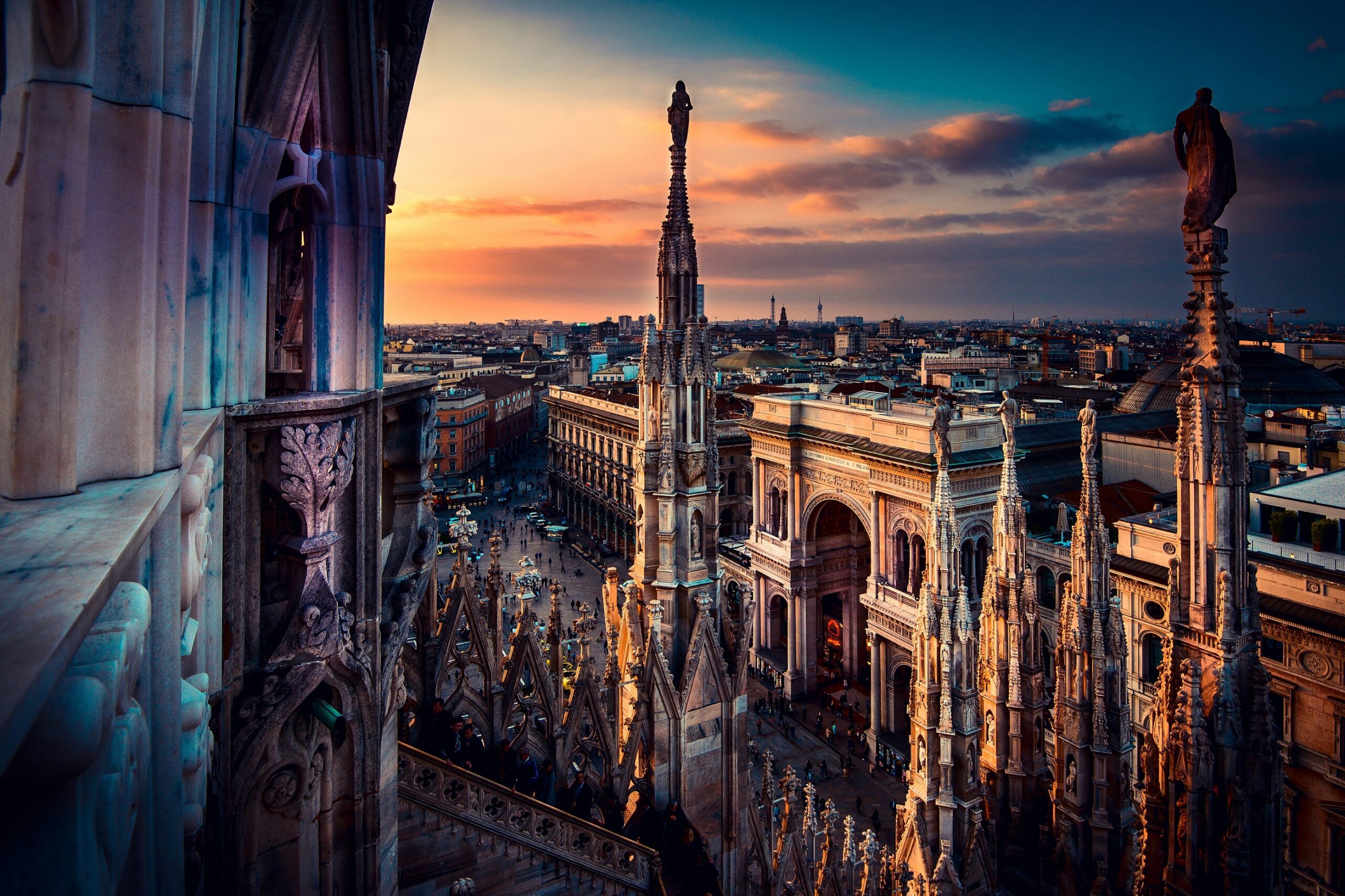 beautiful view at sunset from Duomo cathedral of Milan roof top ...